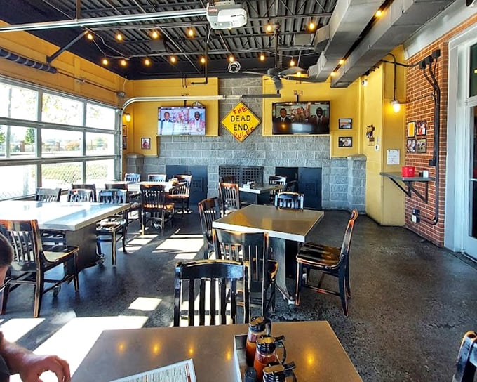 Bright yellow walls and industrial charm create the perfect backdrop for seriously good barbecue without the pretense.