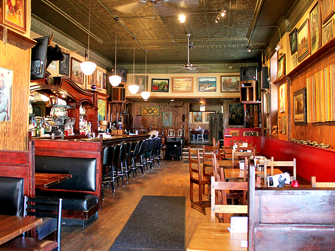 The tin ceiling and vintage posters create an atmosphere that says "relax, you're among friends who take meat seriously."