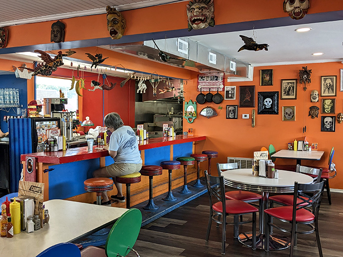 Orange walls and monster masks create an atmosphere that's part funhouse, part your favorite neighborhood hangout.