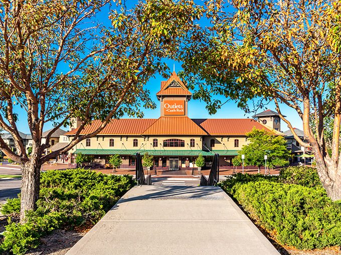Qdoba's distinctive copper-topped building stands as a beacon for hungry shoppers. Those trees aren't just pretty&mdash;they're providing shade for your post-shopping recovery.