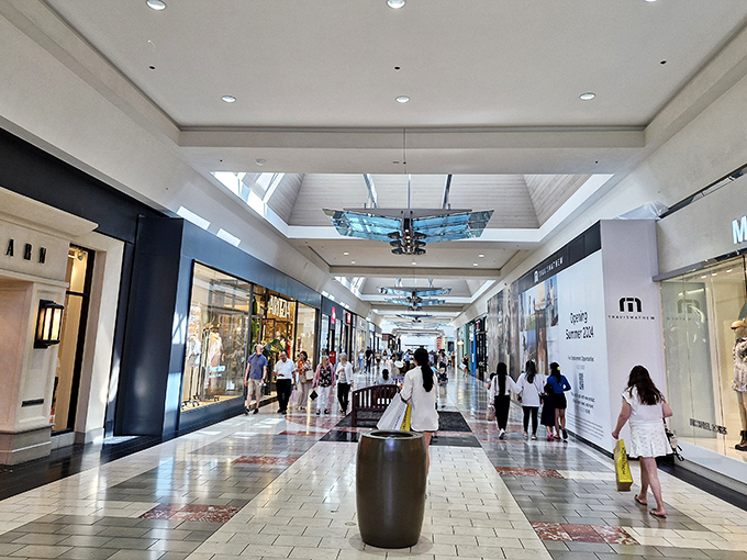 JCPenney's distinctive brick exterior anchors one end of the mall, standing sentinel over a sea of vehicles whose owners are inside hunting for bargains.