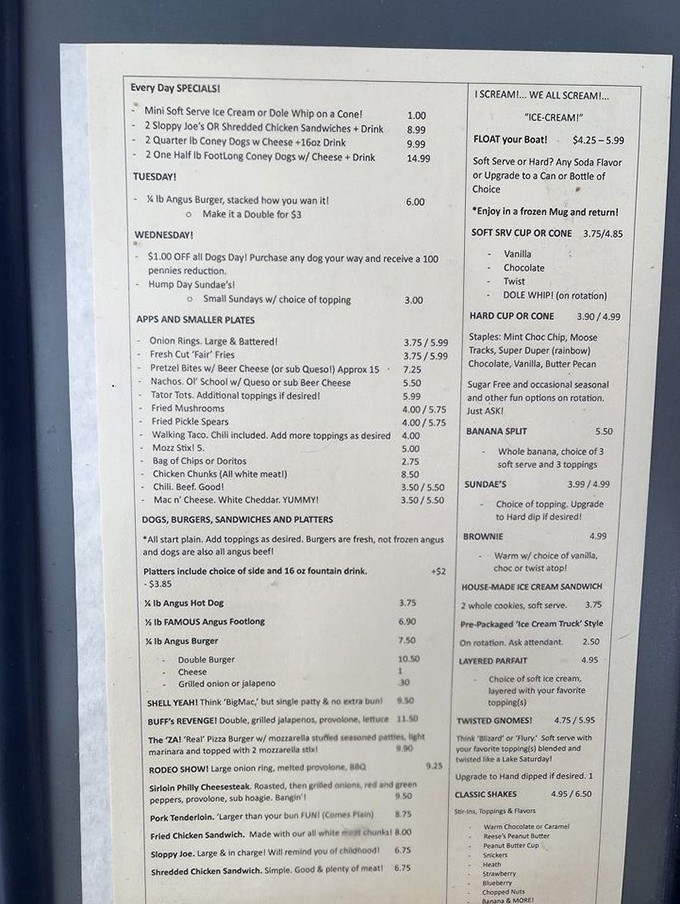 The menu reads like a love letter to American comfort food, complete with exclamation points that somehow make "Large & Battered!" onion rings sound like breaking news.