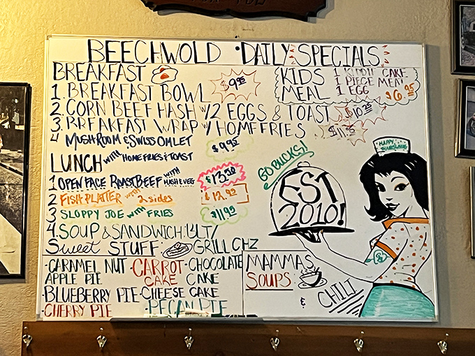 The hand-drawn specials board &ndash; where culinary dreams are sketched in marker. That retro waitress illustration isn't just decoration; she's silently judging your breakfast indecision.