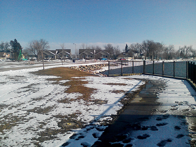 Winter transforms Worthington's landscape into a serene postcard scene, where snow-dusted pathways invite contemplative strolls along Lake Okabena.