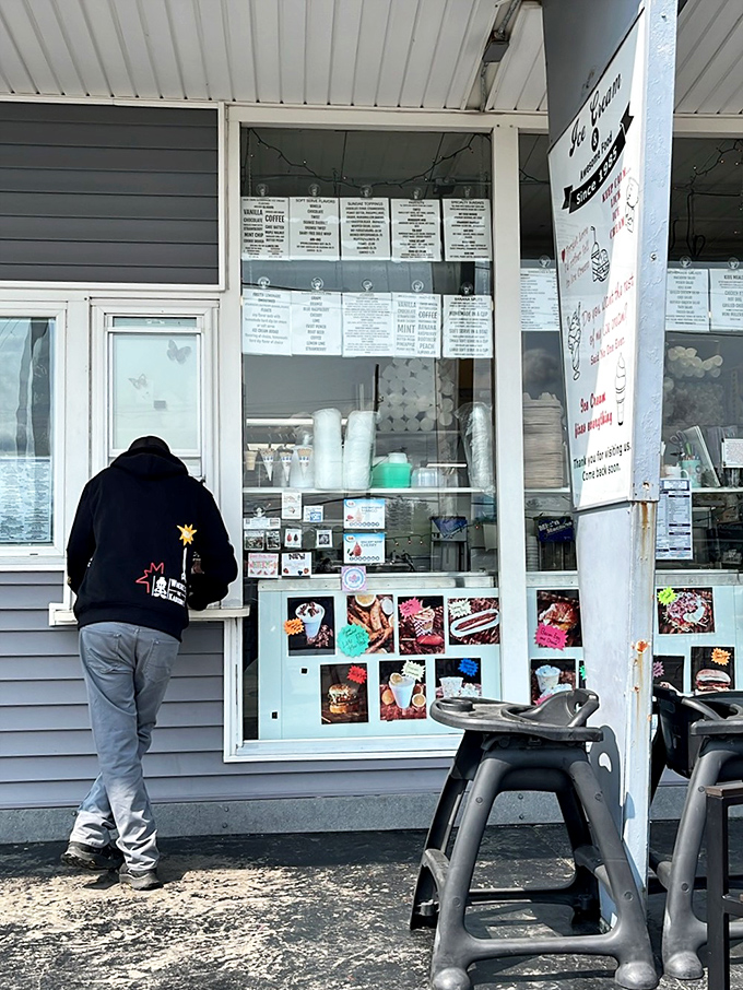 The order window&mdash;where dreams and ice cream cones are handed out with equal care. Menu boards tell stories of comfort food perfected over decades.