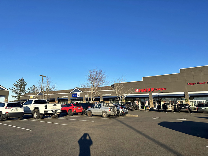 Traditional outlet architecture meets coastal charm, where parking spots are worth their weight in discounted gold.