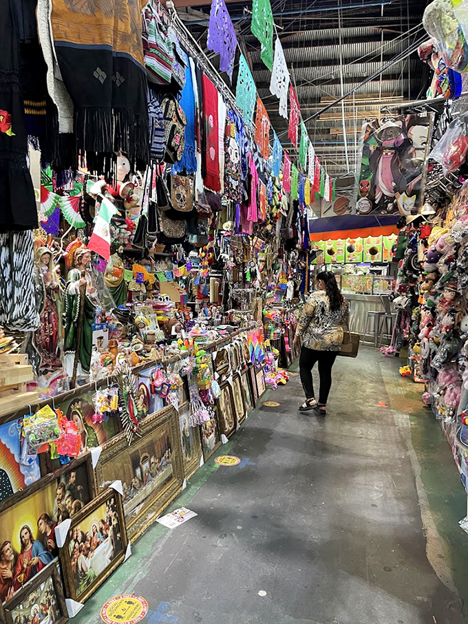 Religious iconography meets vibrant papel picado in this cultural corridor. Like walking through a living museum where everything's for sale.