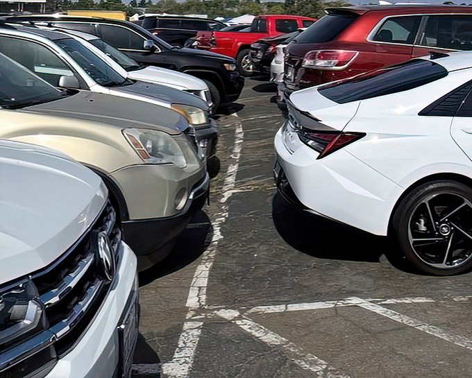 Modern cars line up in perfect formation, a testament to how drive-in culture has evolved while maintaining its communal spirit.