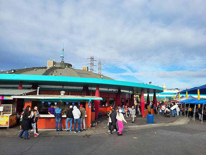 The central hub buzzes with activity as hungry shoppers fuel up between bargain expeditions. Food court or cultural crossroads? Both!