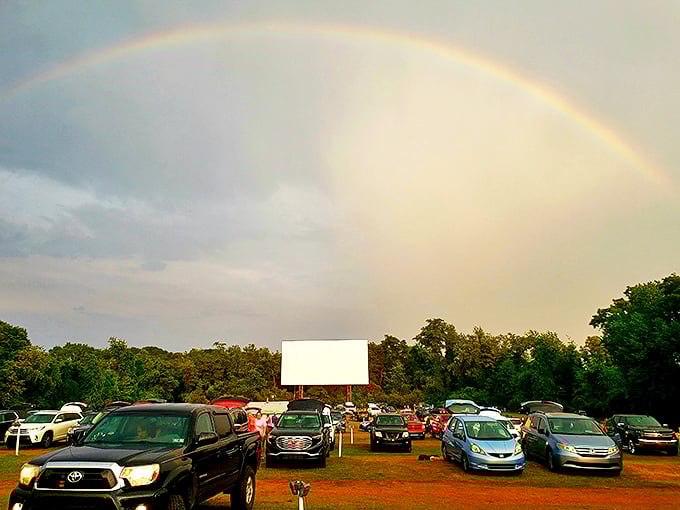 Nature's own special effect: a perfect rainbow arches over moviegoers, as if Hollywood ordered it specifically for tonight's showing.