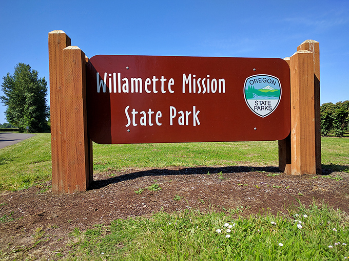The gateway to adventure doesn't need flashing lights&mdash;just this understated wooden sign marking the entrance to one of Oregon's most historically significant natural playgrounds.