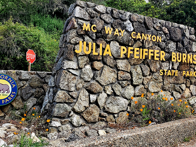 The stone sentinel that marks the entrance to paradise. Those California poppies aren't just decorative&mdash;they're nature's way of rolling out the orange carpet.