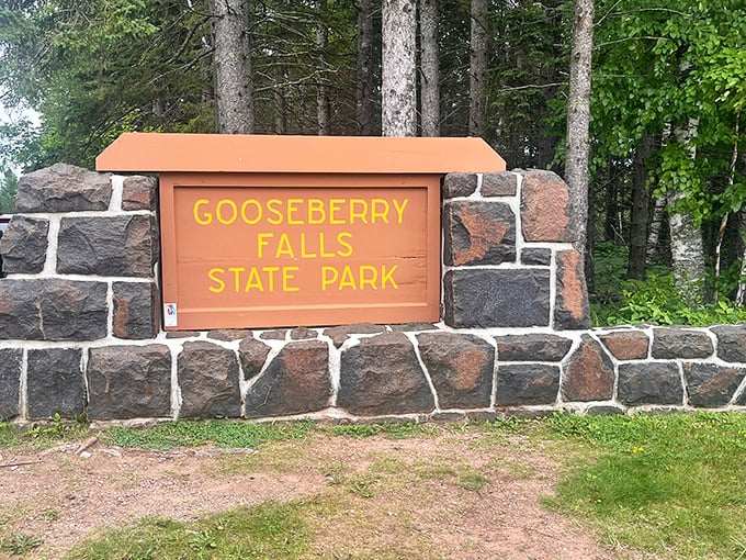 The classic North Shore welcome sign, standing sentinel at the park entrance like a friendly neighbor saying, "Come on in, the water's fine!"