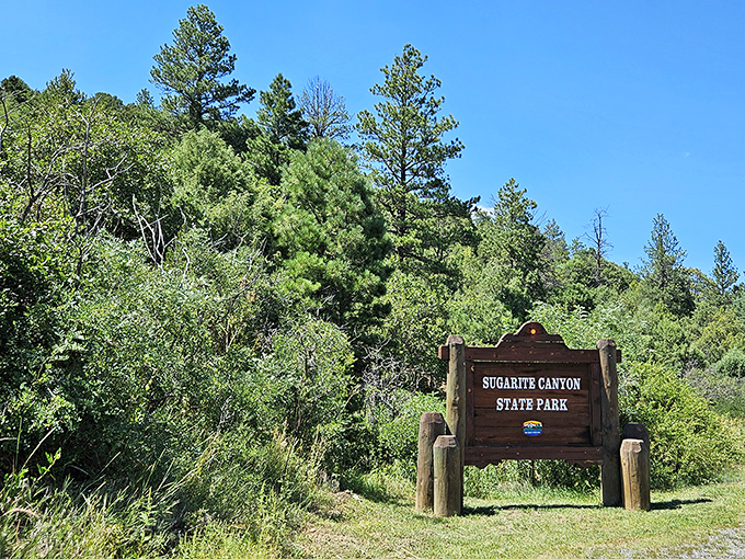The entrance sign stands like a humble gatekeeper to paradise. No velvet rope, no admission fee&mdash;just adventure waiting beyond.