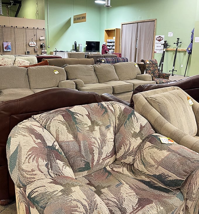 A living room showroom where every sofa has a story. That floral pattern chair? It's seen things. Probably a lot of "Murder, She Wrote."