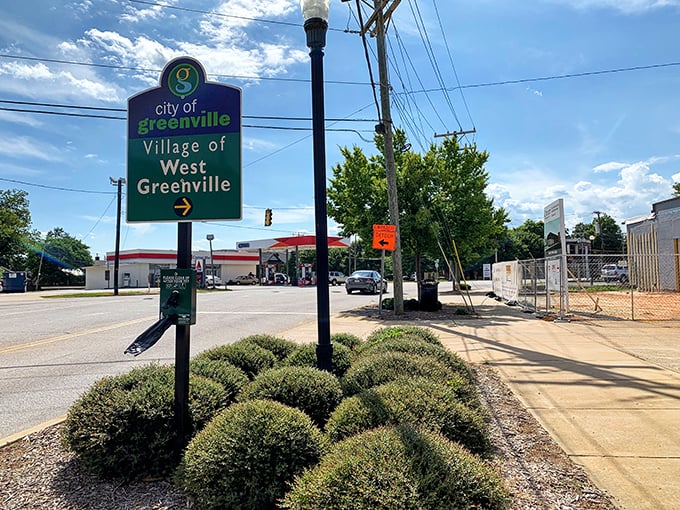 The Village of West Greenville sign welcomes you to a neighborhood that's reinvented itself faster than Madonna, proving second acts are possible for places too.