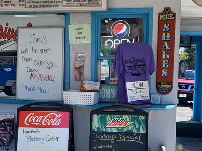 Hand-written signs and homemade cobbler announcements - this takeout window isn't just serving food, it's serving a slice of Americana.