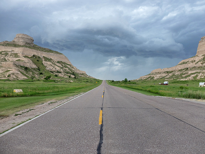 The road to affordability stretches between dramatic bluffs, nature's own version of financial security flanking your journey into budget-friendly living.
