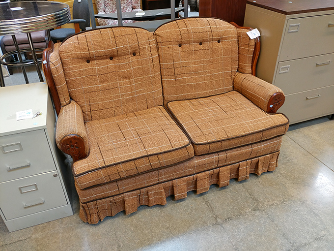 This vintage loveseat isn't just furniture; it's a time machine to Grandma's living room circa 1975. Just add plastic slipcovers and hard candies.
