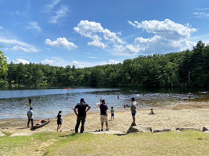 Summer sanctuary in action&mdash;families claiming their slice of paradise along the reservoir's edge, where city stress dissolves faster than an ice cream cone in August.
