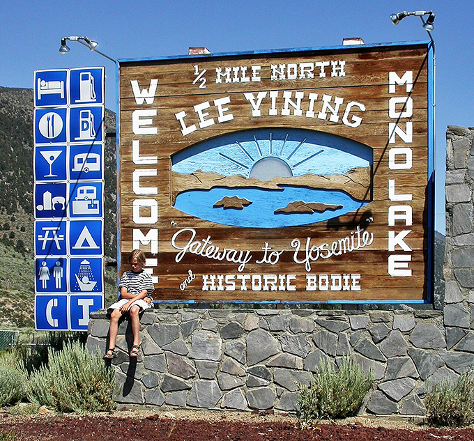 The welcome sign says it all &ndash; half a mile north to adventure, with helpful icons for those who speak the universal language of "I need a bathroom NOW."