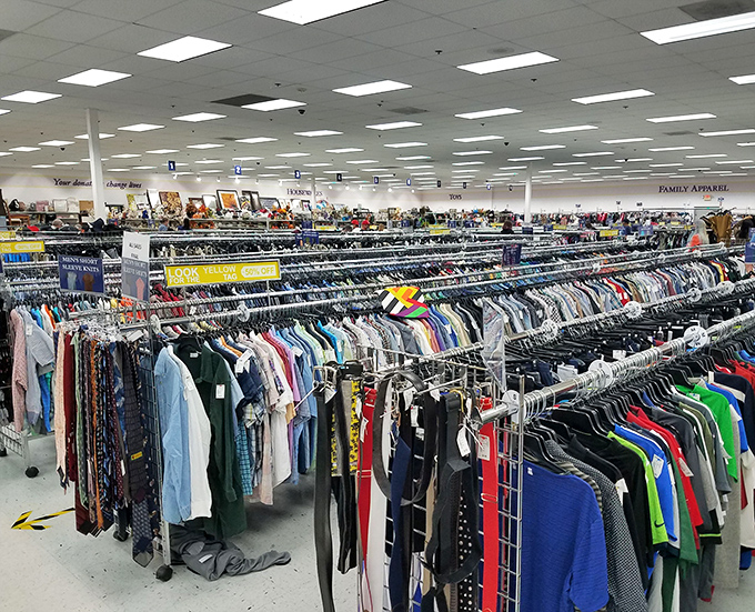 Endless clothing racks stretch like a fashionista's dream, organized better than most department stores at thrift prices.