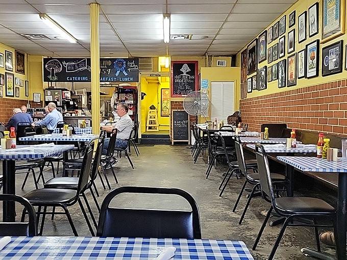 Simple checkered tablecloths and walls full of stories create the perfect backdrop for serious Southern comfort eating.