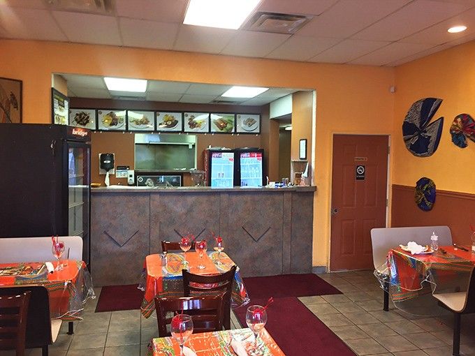 Bright walls and African art create an atmosphere that's part dining room, part cultural journey to Senegal's warmth.