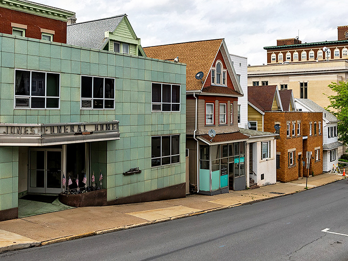 Altoona's charming streetscape showcases its small-town appeal. The mint-green municipal building stands as a colorful landmark among vintage architecture.