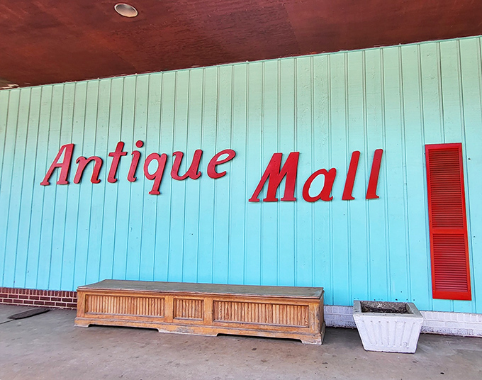 Bold red lettering announces serious antique business - this isn't your typical roadside curiosity shop, folks.