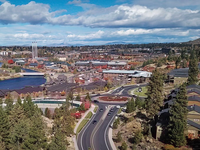 Bend's cityscape nestled against the mountains&mdash;where outdoor adventure meets urban comfort in perfect harmony.