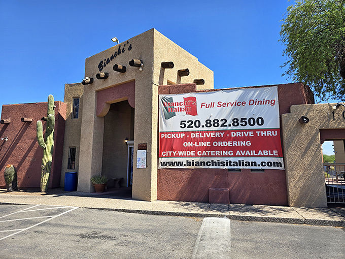 Adobe walls and desert landscaping whisper promises of authentic Italian flavors within.