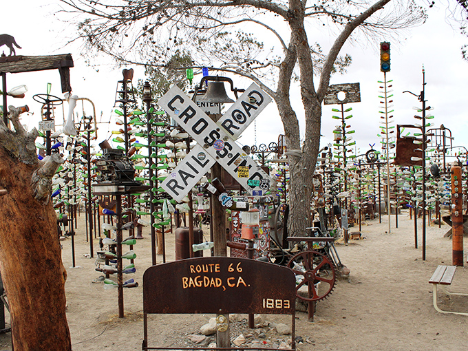 Metal trees adorned with colorful bottles create a tinkling forest of light and sound along Route 66.