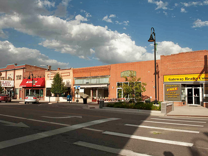 Classic brick buildings line the street, where time moves slower and neighbors still wave hello.