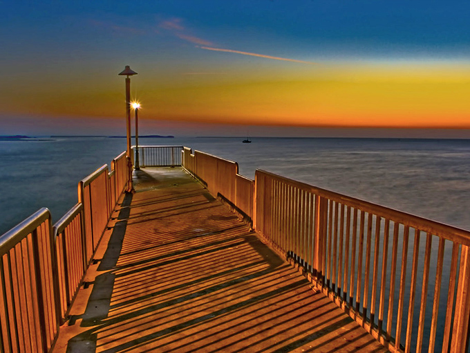 Sunset magic at its finest! This wooden pier stretches toward tomorrow with golden promise.