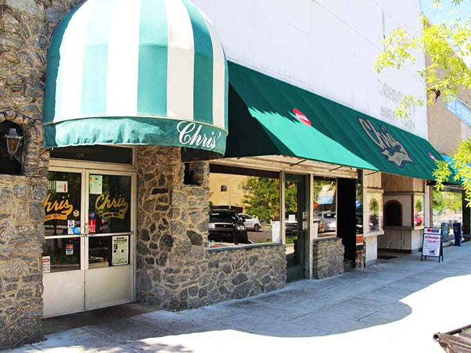 Chris' Famous Hotdogs' stone exterior and green awning beckon like an old friend who always knows exactly what you need.
