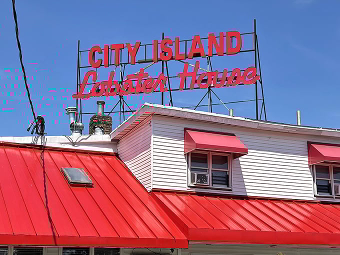 That classic red roof screams "lobster house" louder than any neon sign ever could dream of.