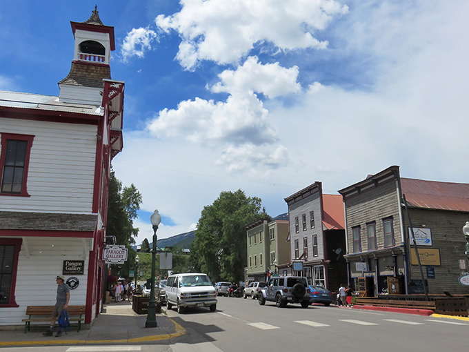 Crested Butte's historic district welcomes visitors with colorful buildings that pop against the dramatic mountain backdrop.