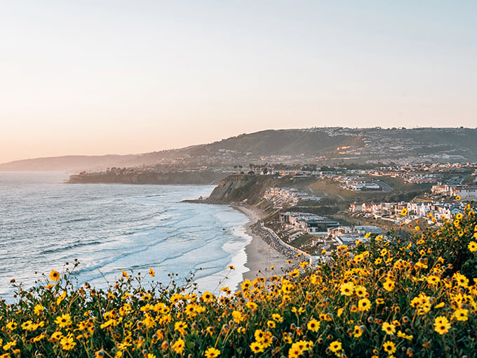 Golden hour magic paints the coastline like a watercolor dream. Sunsets here are nature's Netflix.