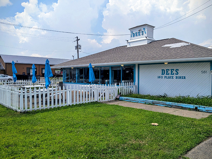 Dee's 50's Place welcomes you with its cheerful blue accents and white picket fence &ndash; Norman Rockwell would approve!