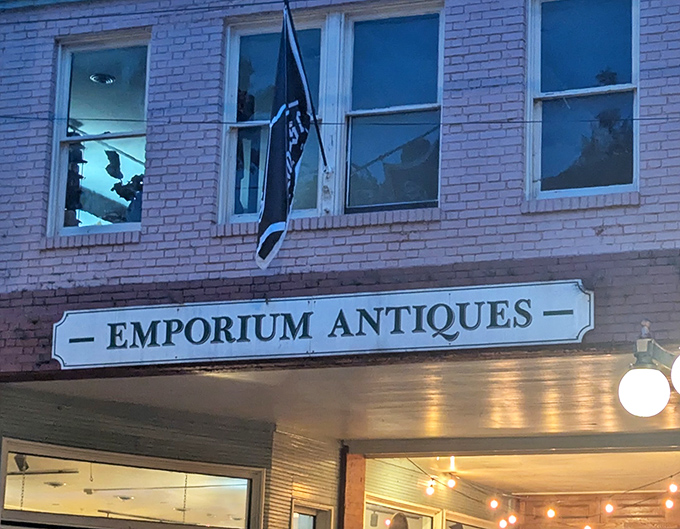 Emporium Antiques' brick facade and vintage flag create the perfect first chapter to your treasure-hunting adventure story.