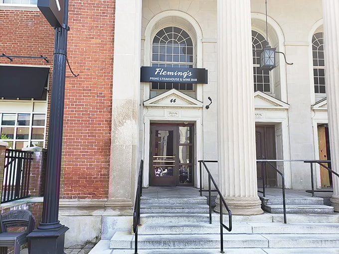 Classic columns and brick create the perfect backdrop for an unforgettable steakhouse experience ahead.