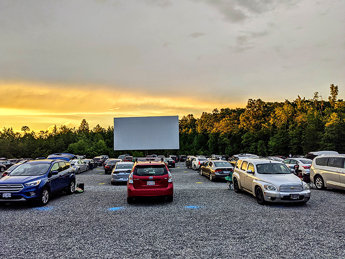 Movie magic at dusk! Goochland's gravel lot fills with eager viewers as the golden sunset gives way to showtime.