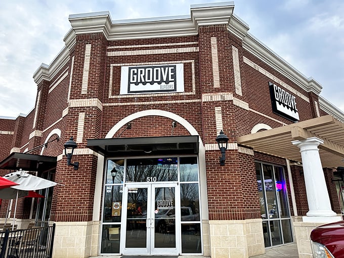 Groove Burgers' modern brick exterior promises contemporary comfort food with a college town twist.