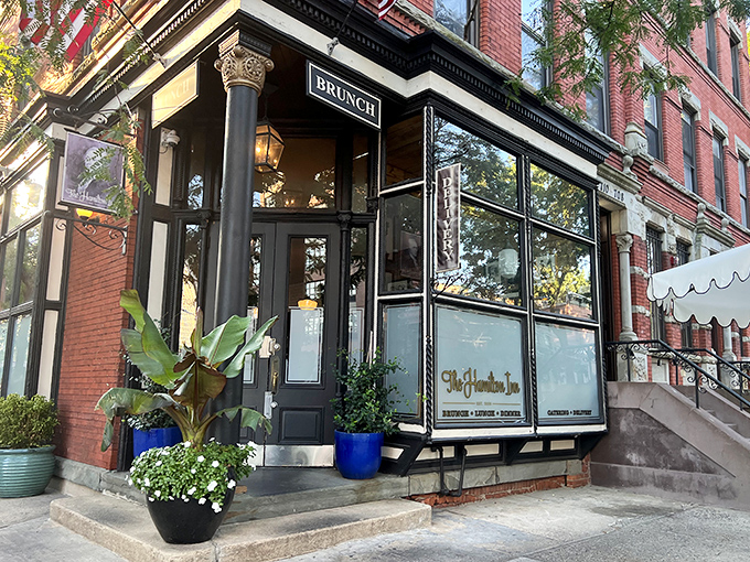 Hamilton Pork's elegant storefront brings upscale vibes to Jersey City's BBQ scene. Those potted plants aren't the only things flourishing here!