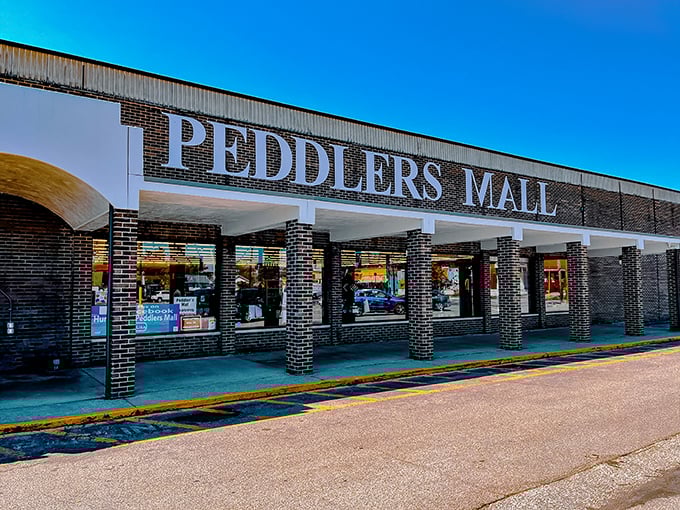 Peddlers Mall's brick facade stands proudly, its red lettering a beacon for bargain hunters across Huntington.