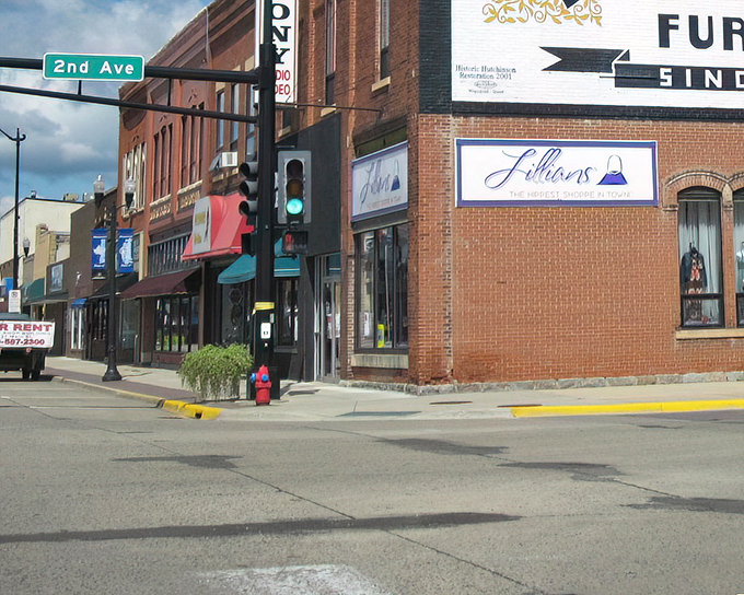 This brick-lined street whispers stories of generations who built their dreams one storefront at a time.