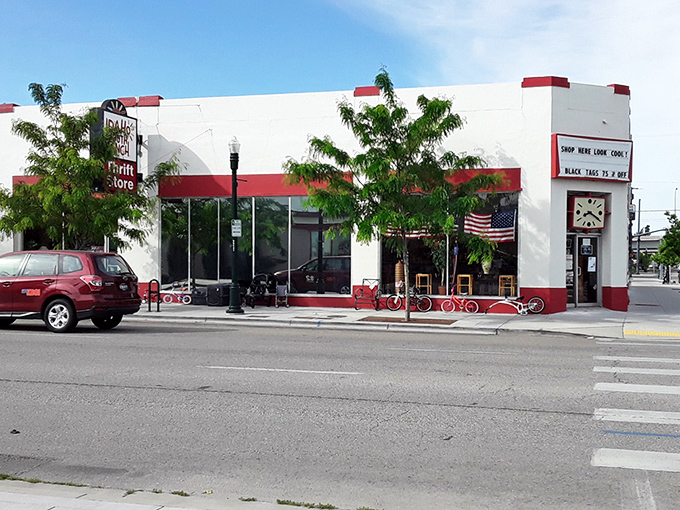 That classic red-striped storefront practically whispers "come find your next favorite vintage treasure here."