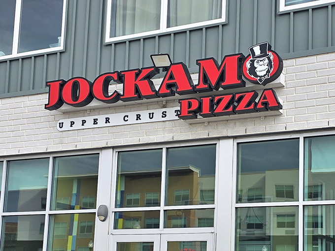 Jockamo's bold red signage announces its pizza mission with confidence &ndash; no need to whisper when your crust speaks volumes.