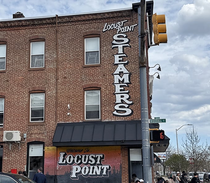L.P. Steamers' vertical sign stands tall against Baltimore's sky, like a lighthouse guiding hungry sailors to crab paradise.